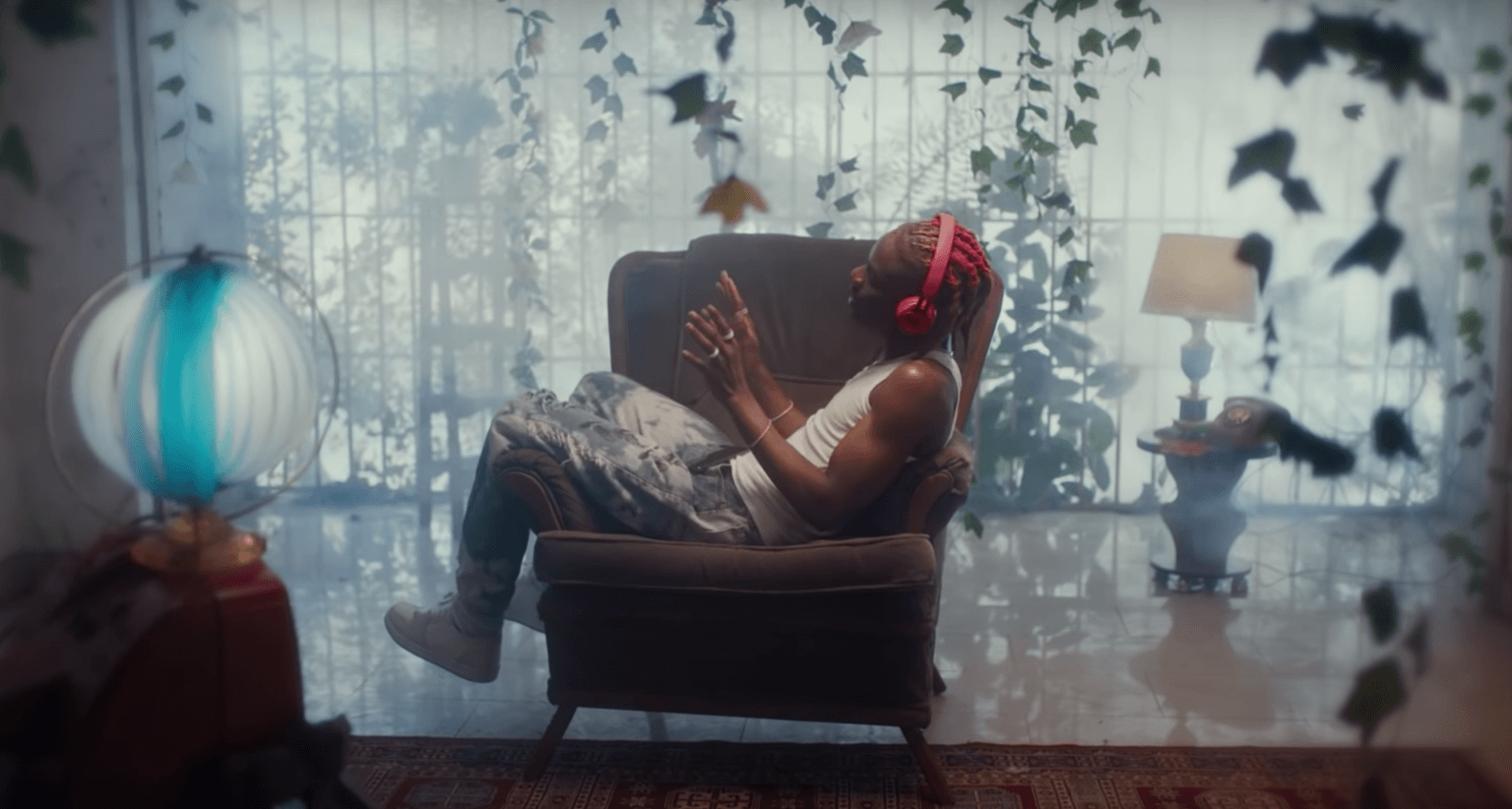Rema is an adoring lover boy for "Ginger Me" video